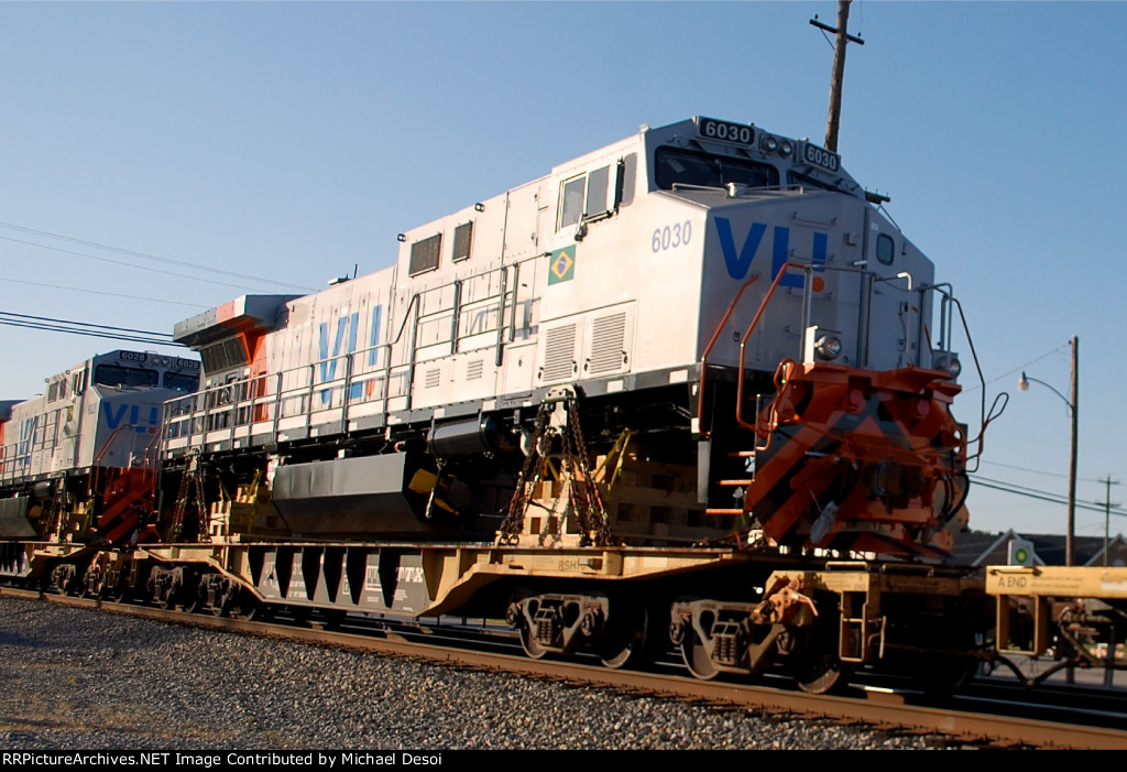 VLI BB40-9WM #6030 is one of 8 locomotives in this train heading east bound for the port of ...